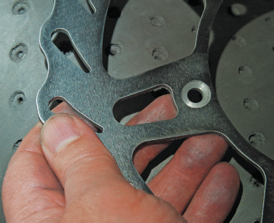 Machines clean up motorcycle brake disc rotors - Factory & Handling ...